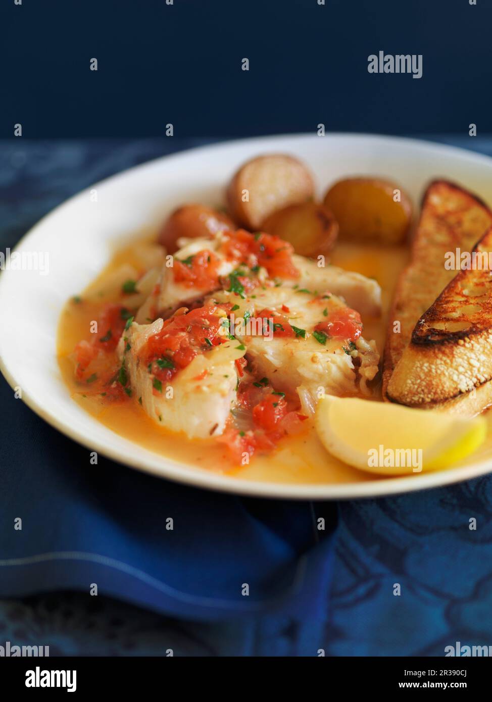 Poached fish with potatoes Stock Photo - Alamy