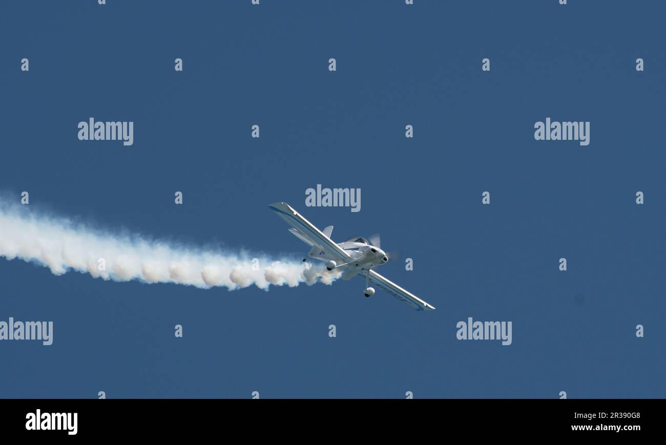 Stunt plane trailing white smoke at Clacton Airshow Stock Photo - Alamy