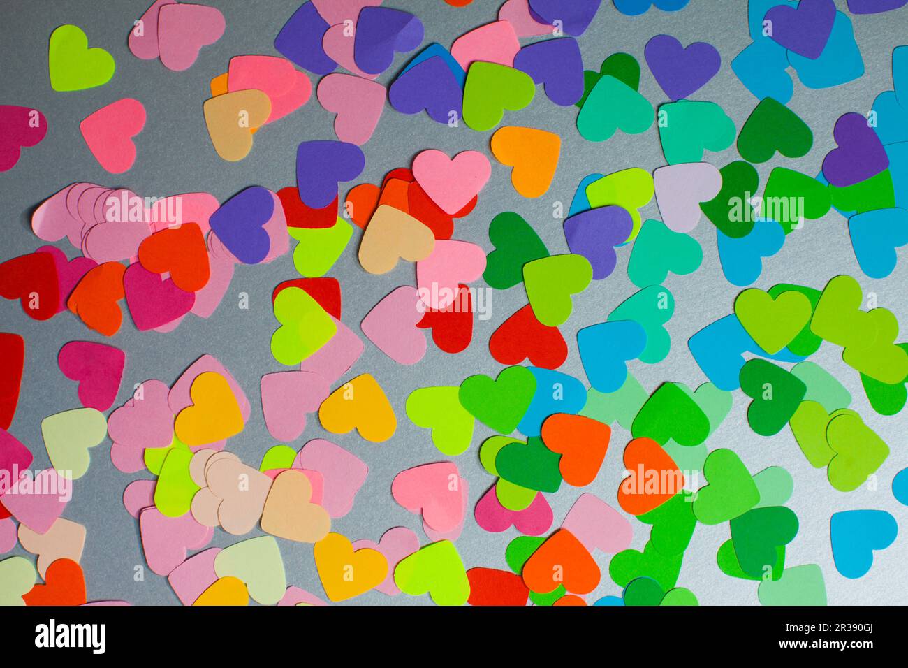 Paper rainbow colors hearts as a pattern for design Stock Photo - Alamy