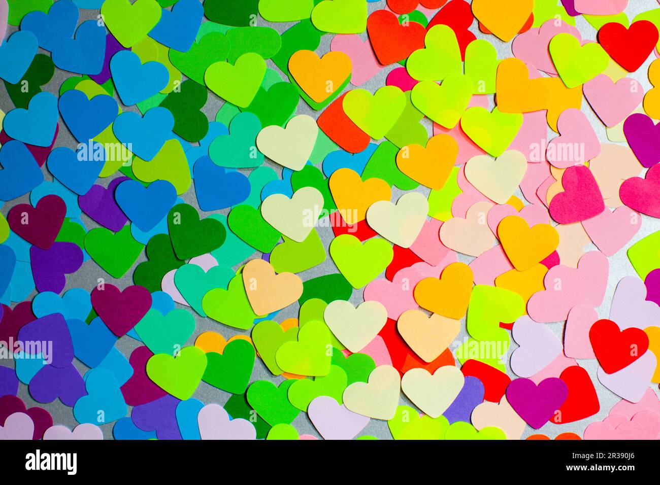 Paper rainbow colors hearts as a pattern for design Stock Photo - Alamy