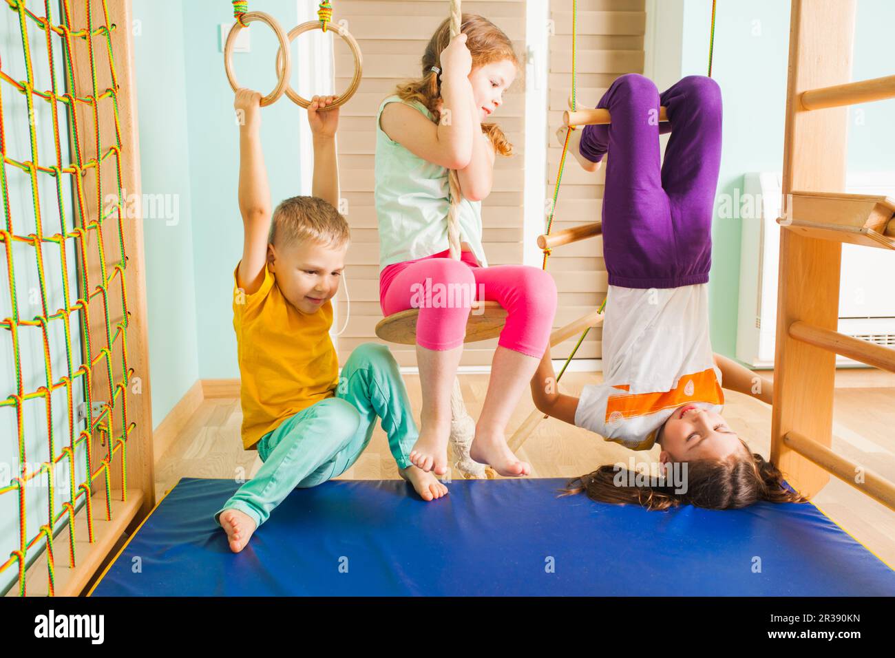 Children playing together in home kids gym Stock Photo - Alamy