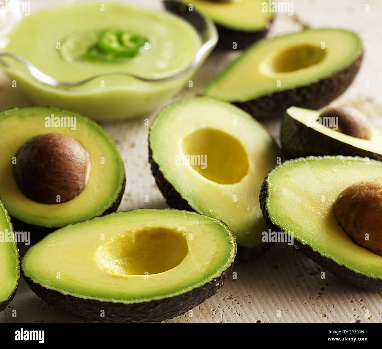 Avocado soup and avocado halves Stock Photo - Alamy