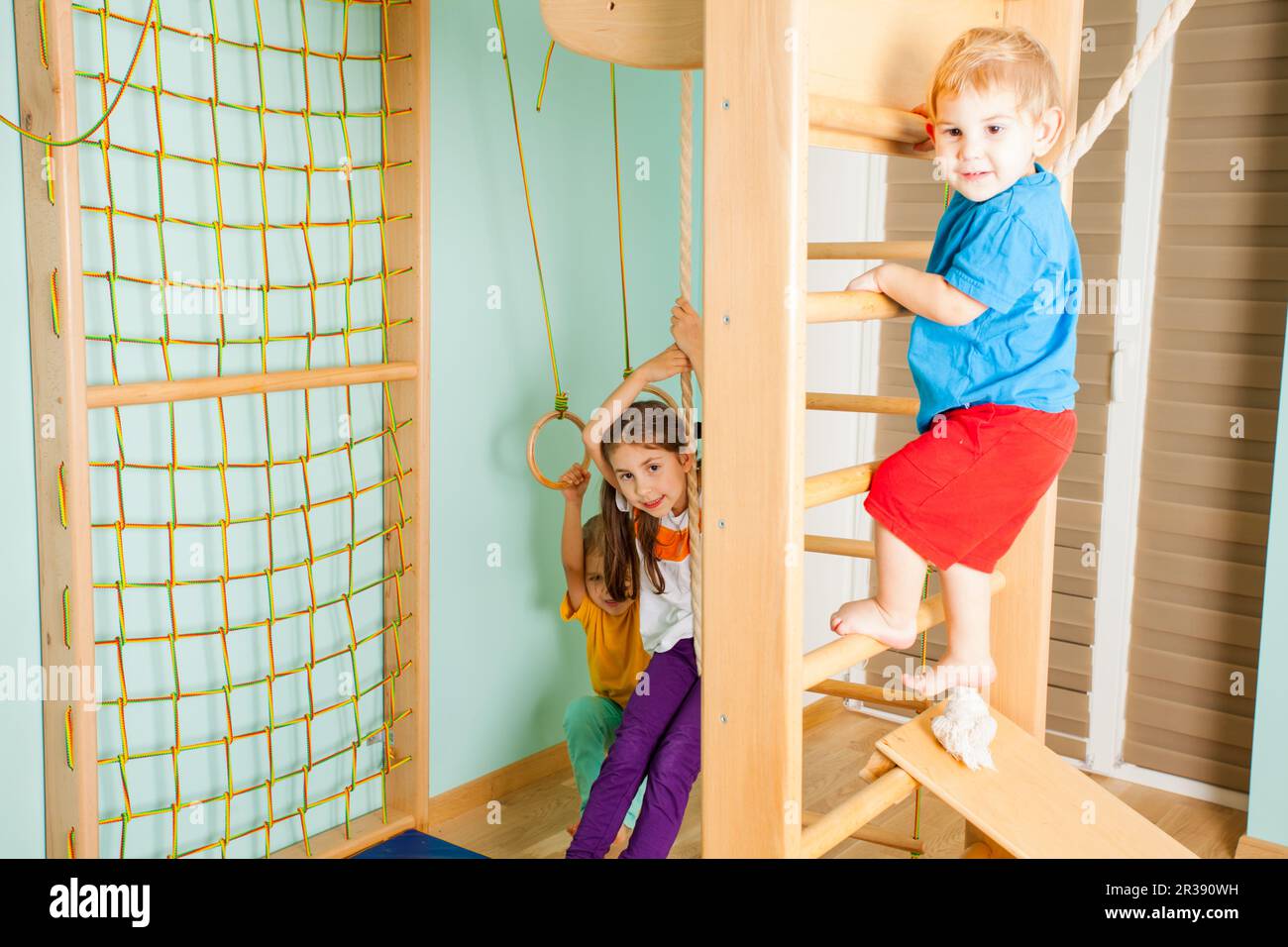 Children playing on a wooden sport complex Stock Photo - Alamy