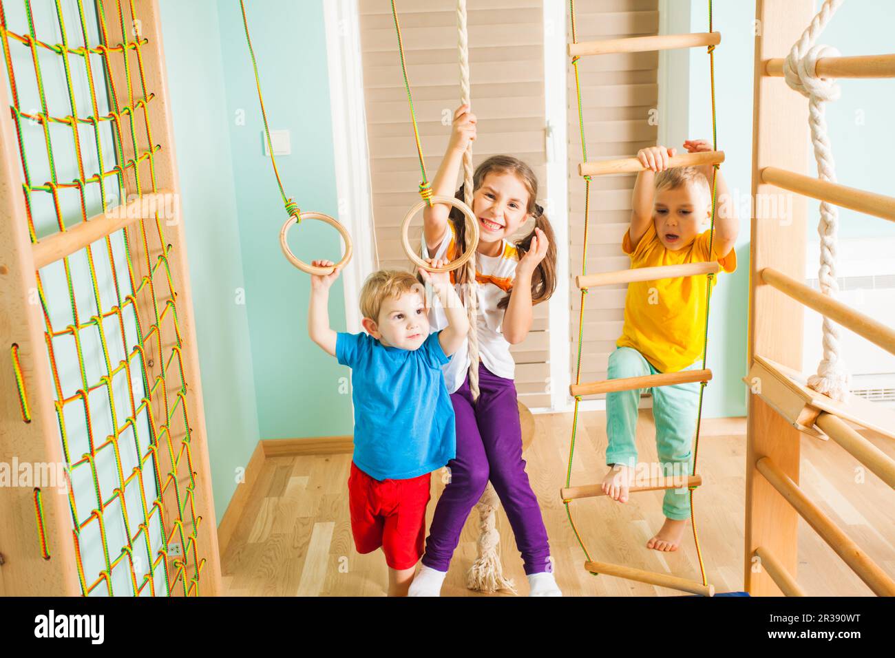 Active children excercising together at home training complex Stock ...