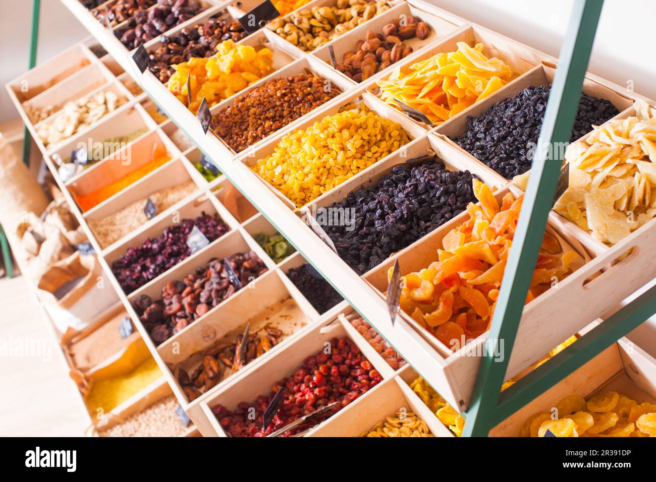 Colorful dried fruits assortment on a rack at the store Stock Photo - Alamy