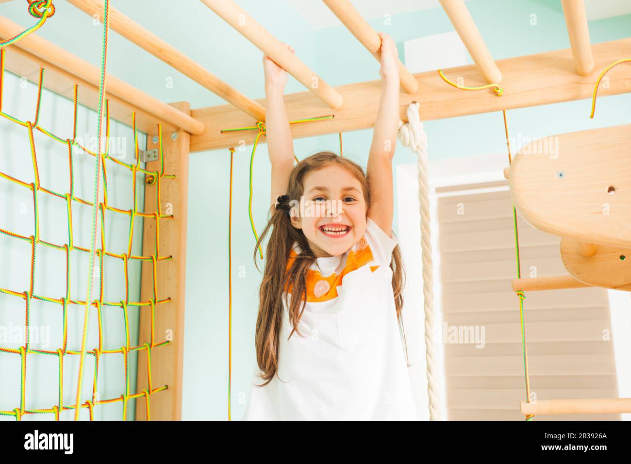 Girl climbing a ladder hi-res stock photography and images - Alamy