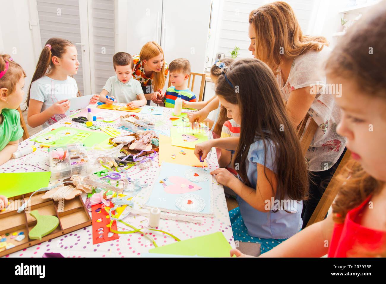 Children spend time together making lovely postcards Stock Photo - Alamy