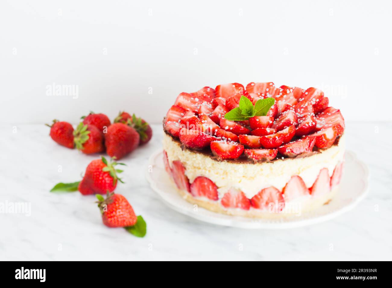 Strawberry cake Fraisier on the white plate and cups Stock Photo - Alamy
