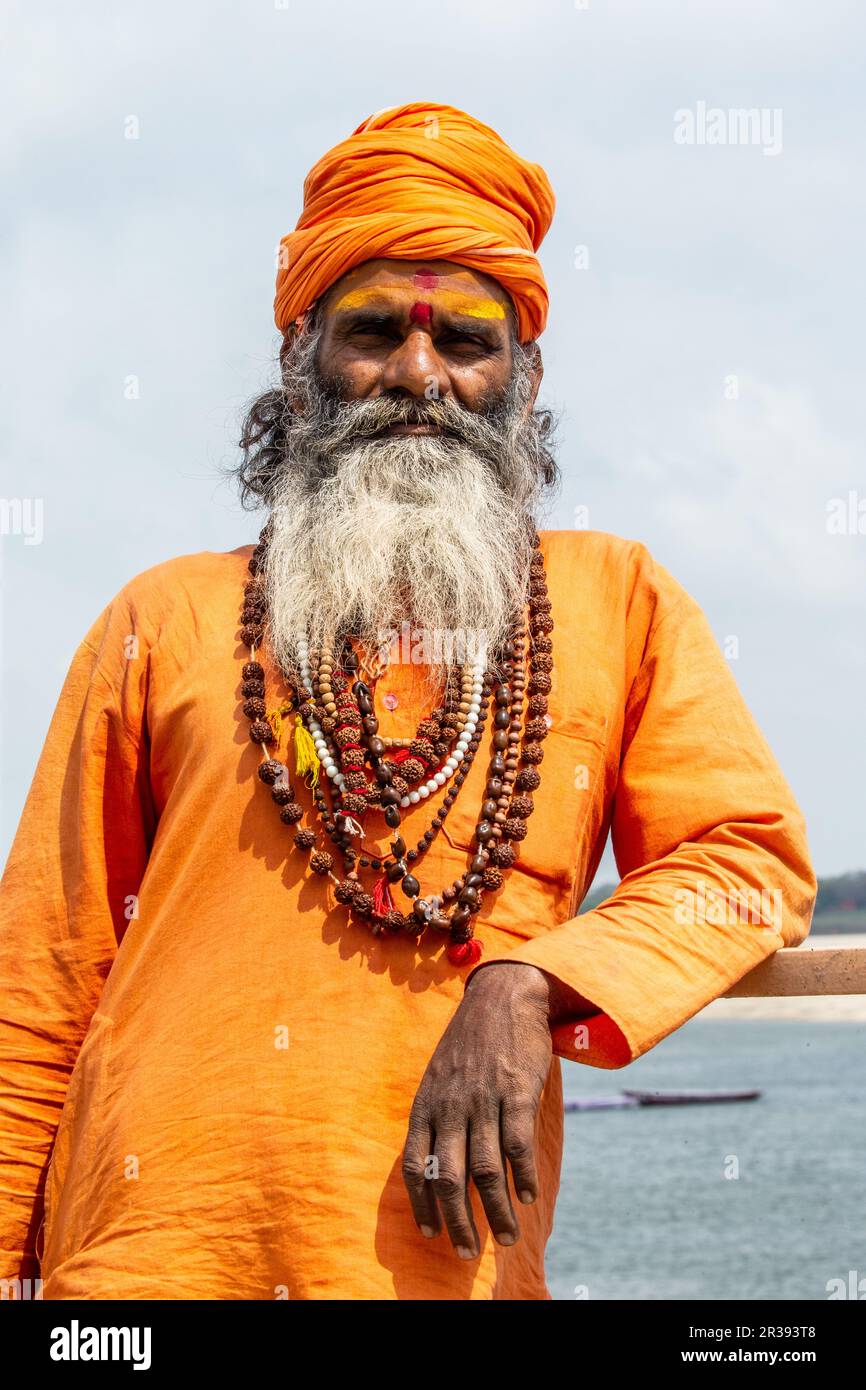 Portrait of a Sadhu in traditional dress against the background of the ...