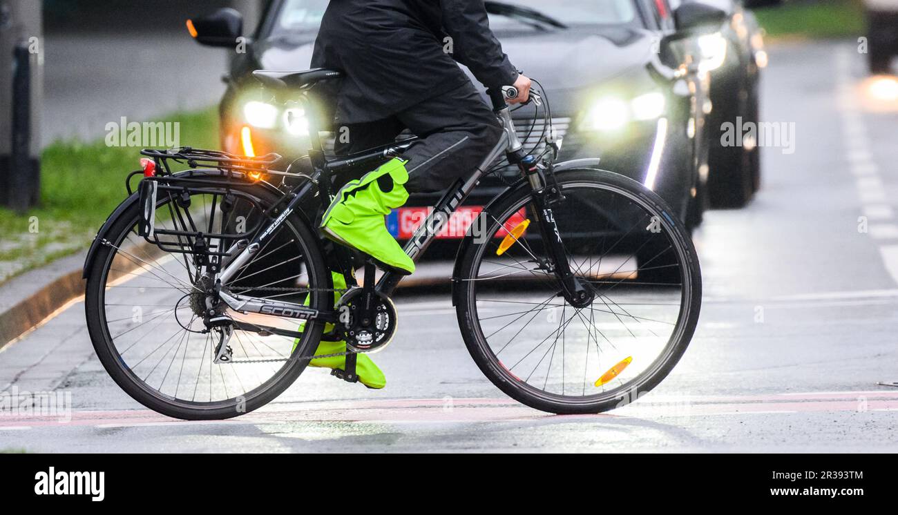 Hanover, Germany. 23rd May, 2023. A woman rides her bicycle through an ...