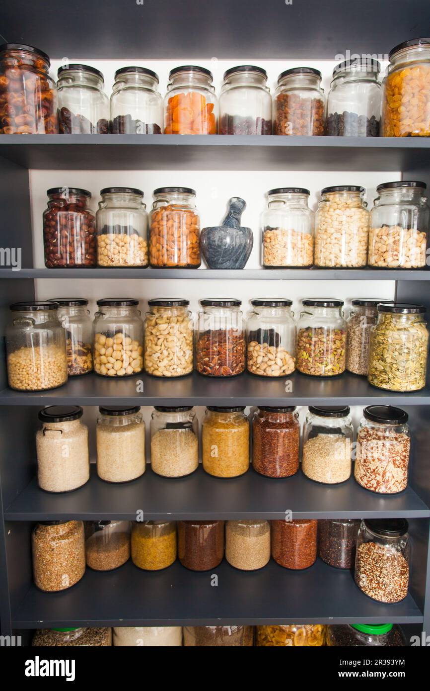 Shelf in a shop with colorful natural herbs and spices Stock Photo - Alamy