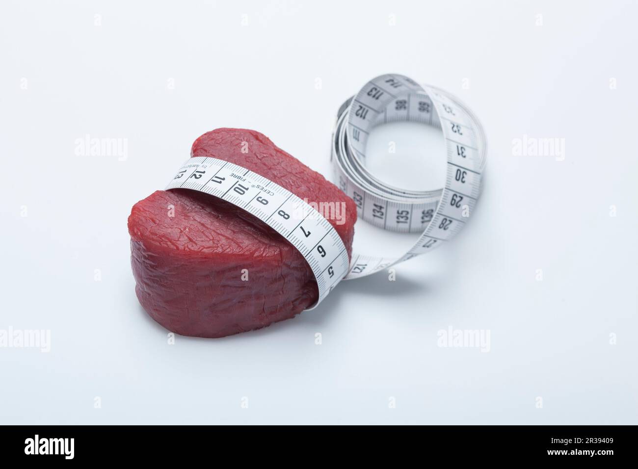 A raw fillet of beef with a tape measure Stock Photo - Alamy