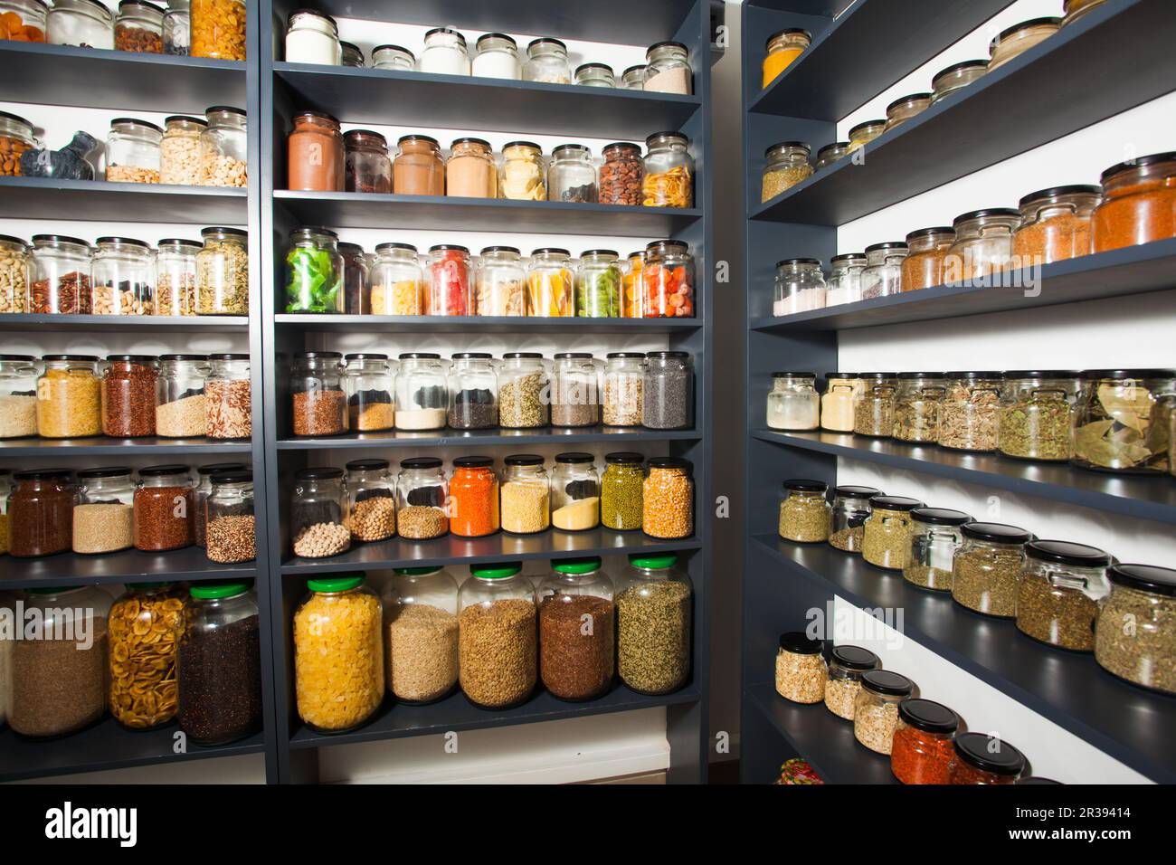 Shelf in a shop with colorful natural herbs and spices Stock Photo - Alamy