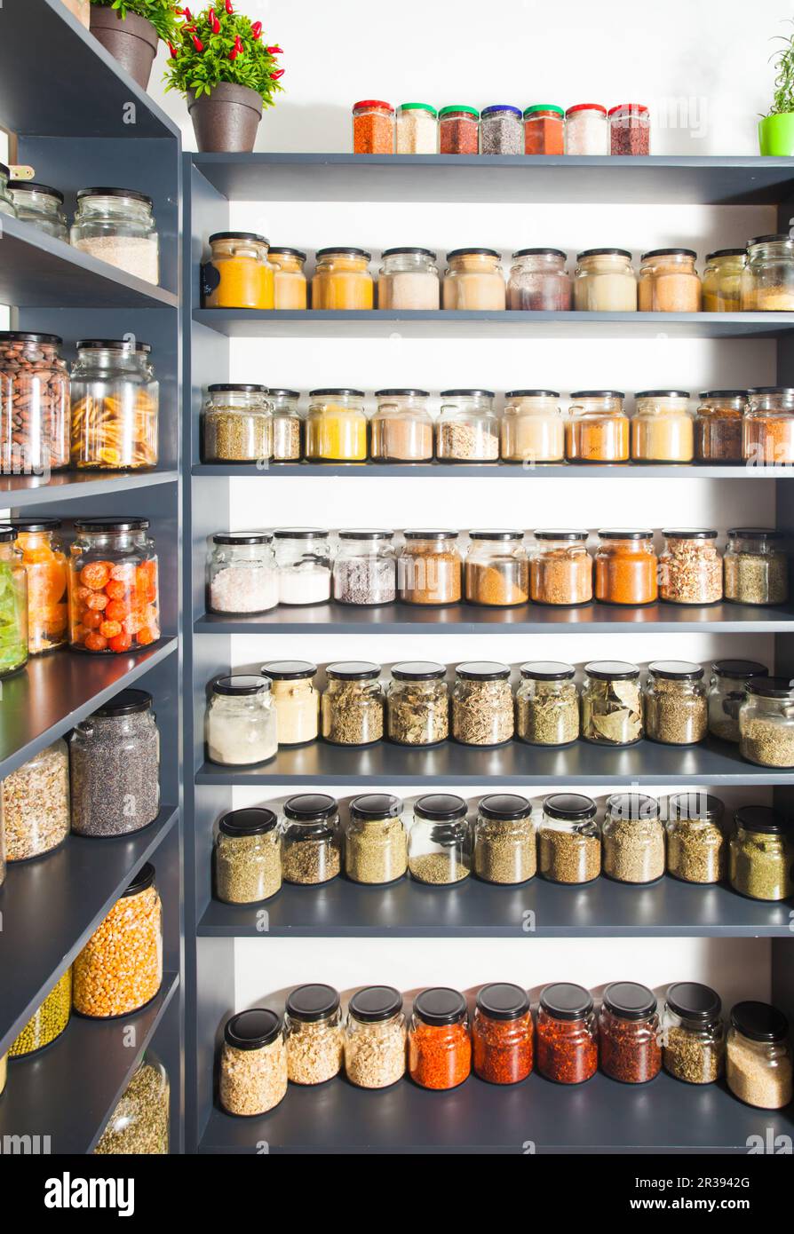 Shelf in a shop with colorful natural herbs and spices Stock Photo - Alamy