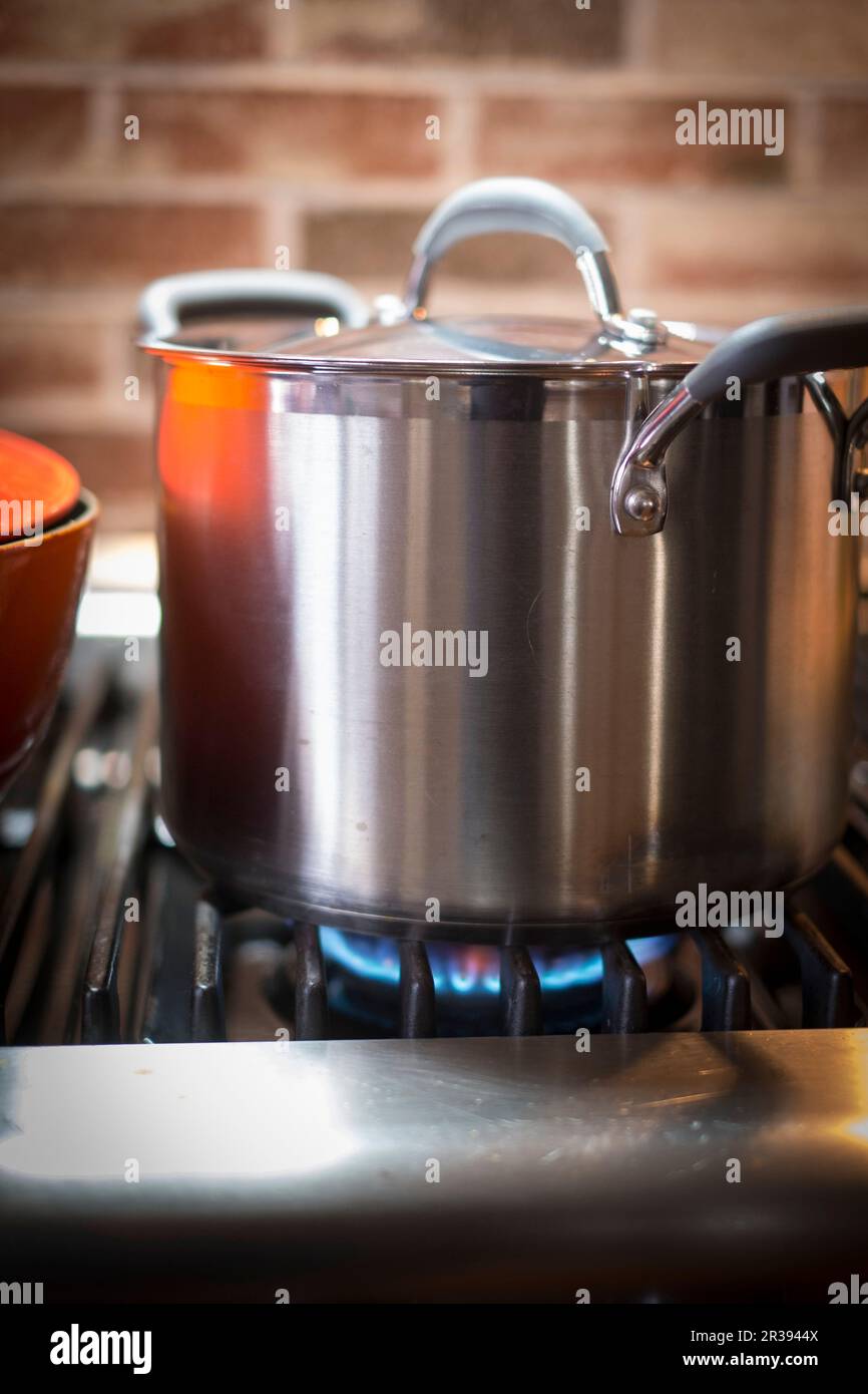 A large pot on a gas hob Stock Photo - Alamy