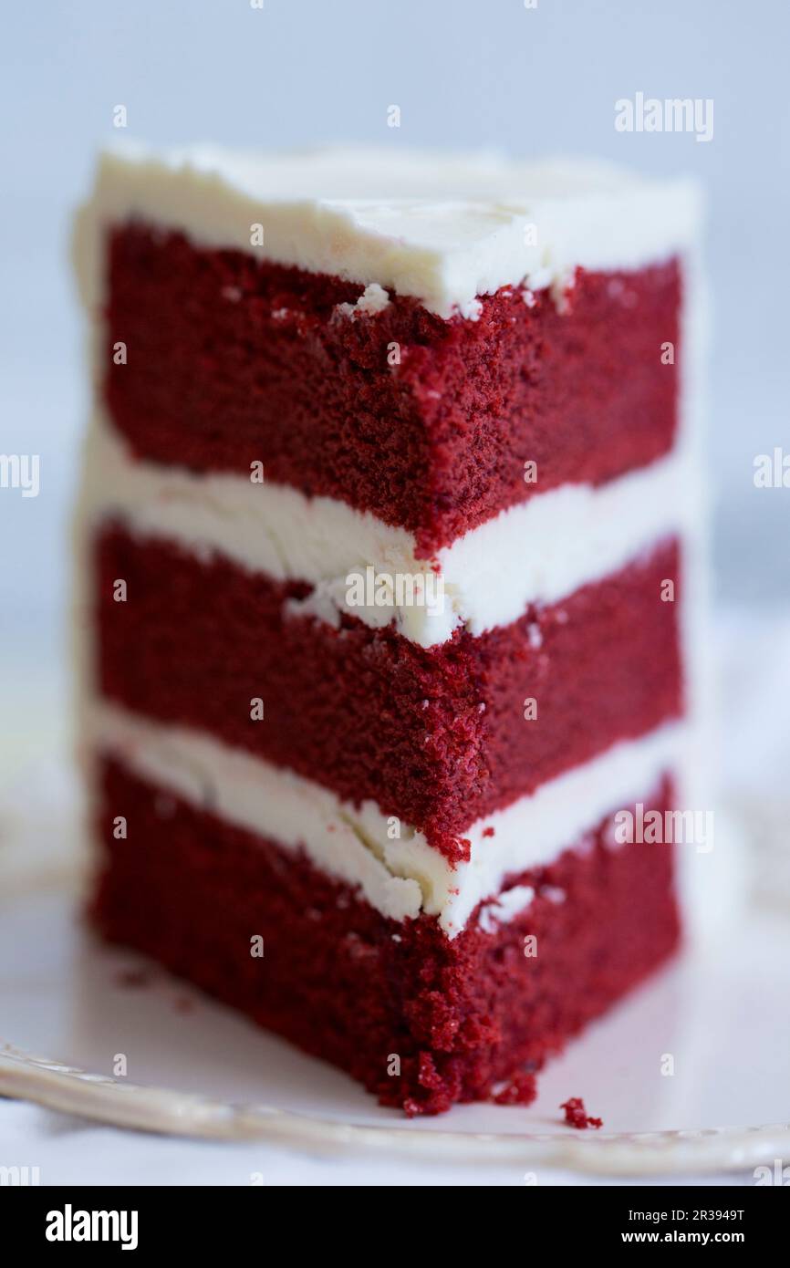 A slice of red velvet cake Stock Photo - Alamy