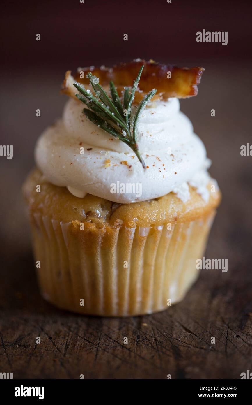 A savoury cupcake with cream cheese, rosemary and bacon Stock Photo - Alamy