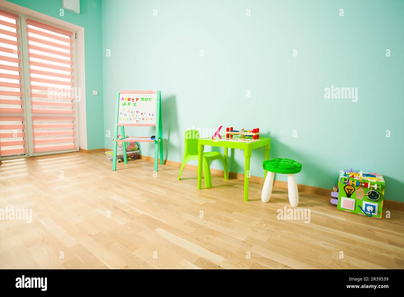 Education corner in the kindergaten with table and board Stock Photo ...