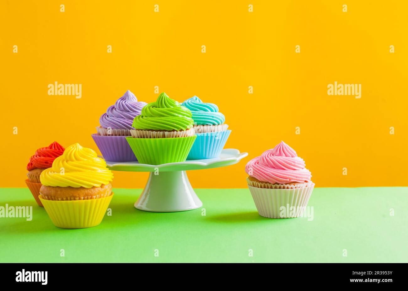 Rainbow colour cupcakes on the cake stand Stock Photo - Alamy