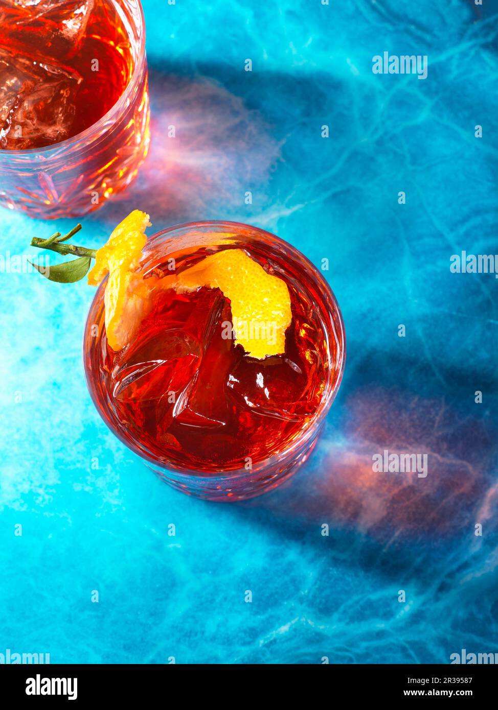Negroni cocktails high angle on blue Stock Photo - Alamy