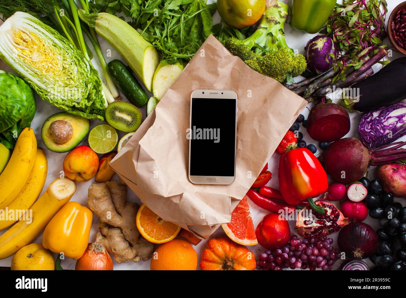 Martphone on the paper bag and vegetables - delivery concept, zero ...