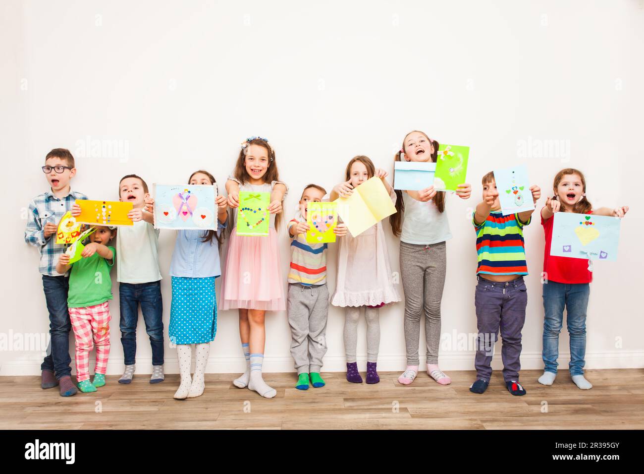 Kids with their handmaded decorations or greeting card Stock Photo - Alamy