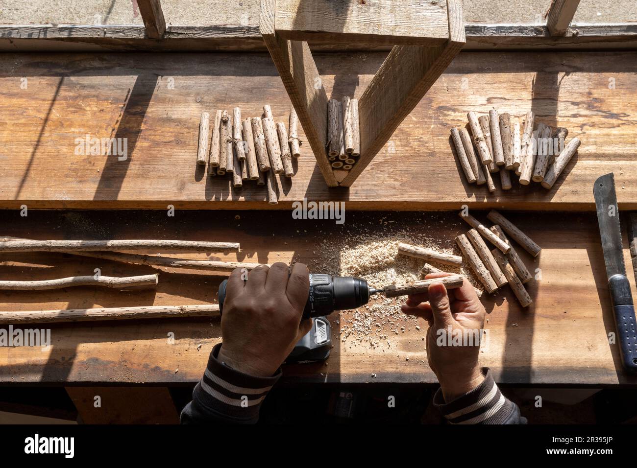 Making wooden insect house decorative bug hotel Stock Photo - Alamy