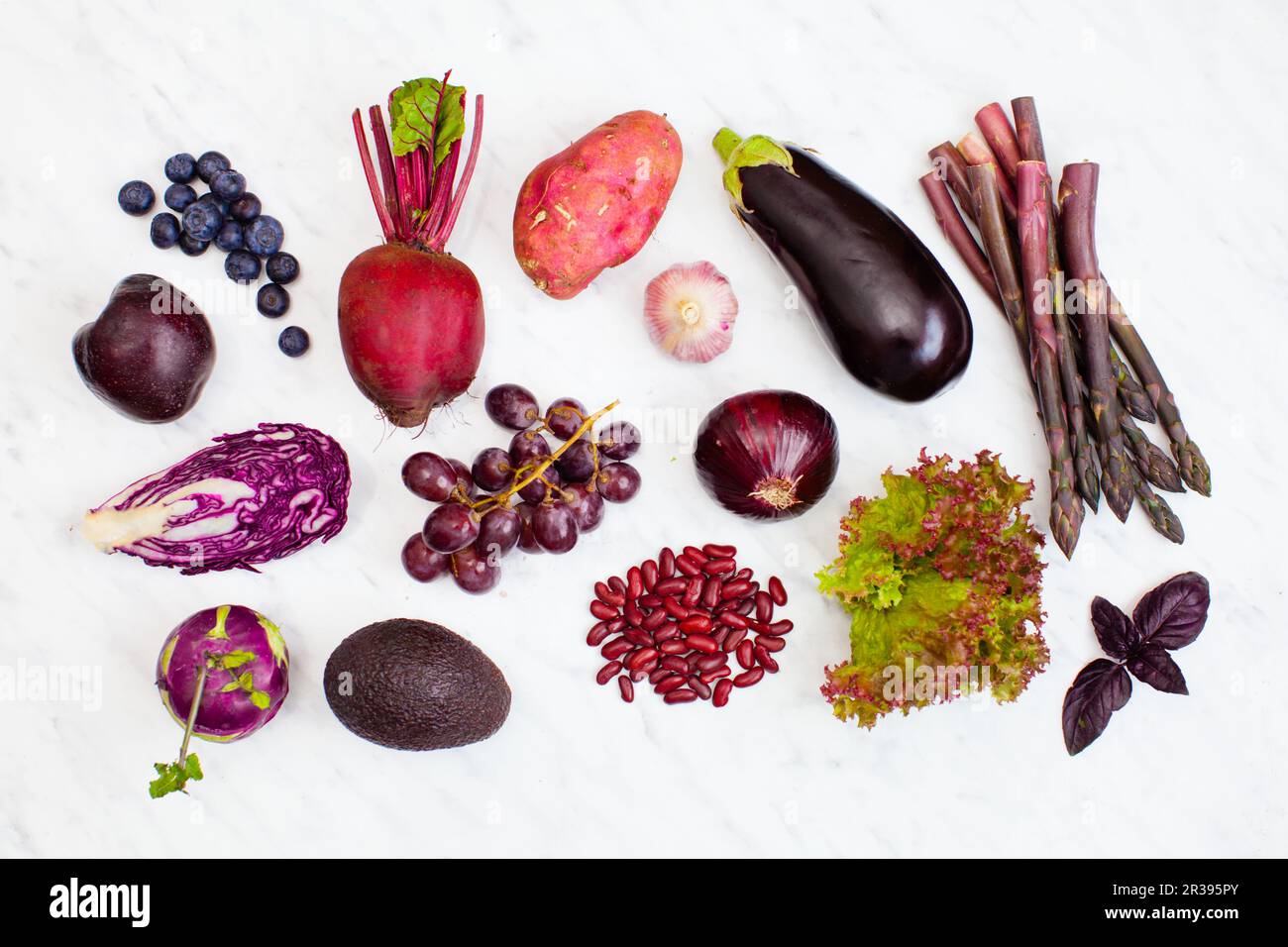 Raw purple vegetables and fruits over white marble Stock Photo - Alamy