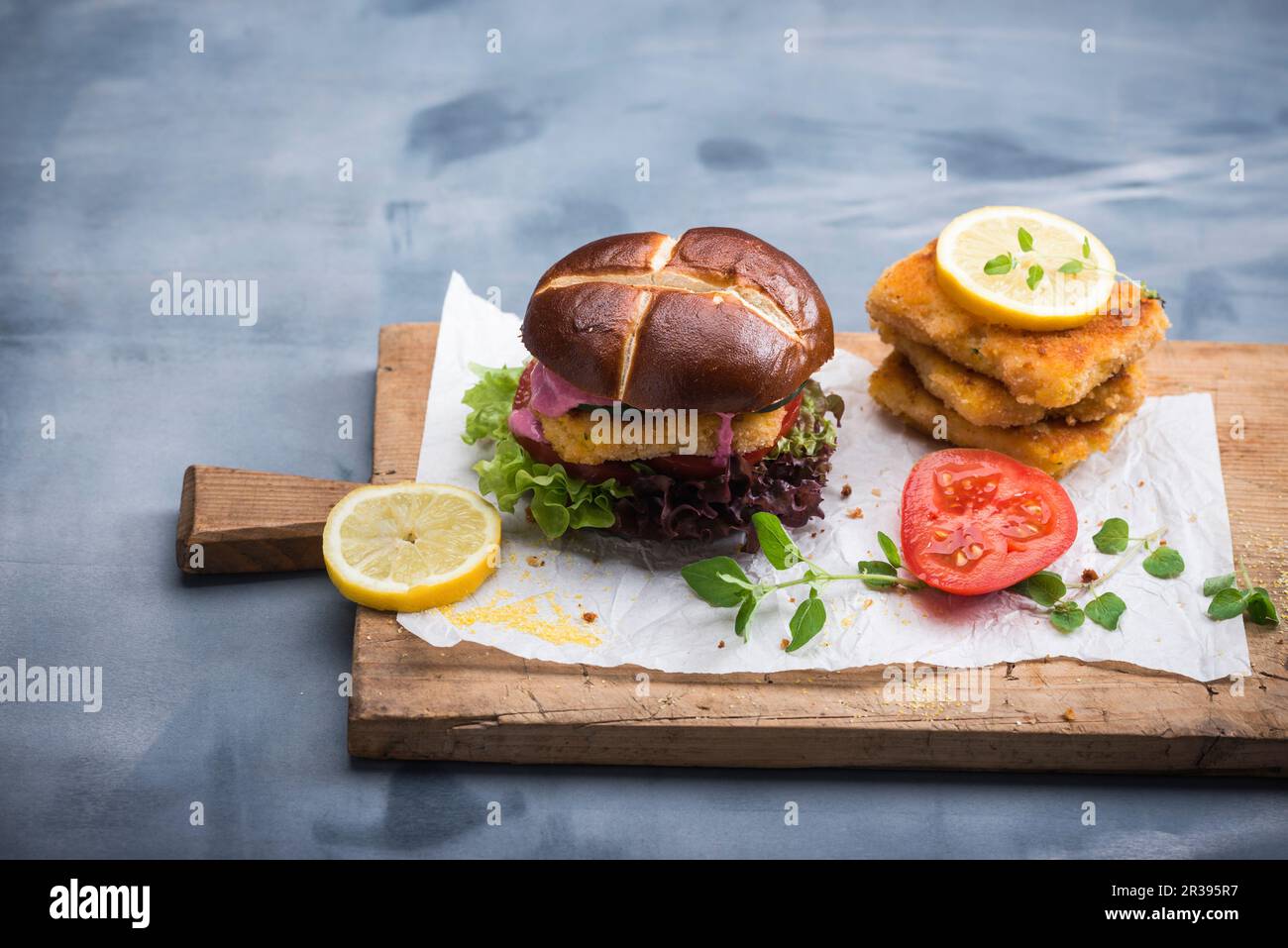Vegan corn steak with vegetables and beetroot hummus in a lye roll ...