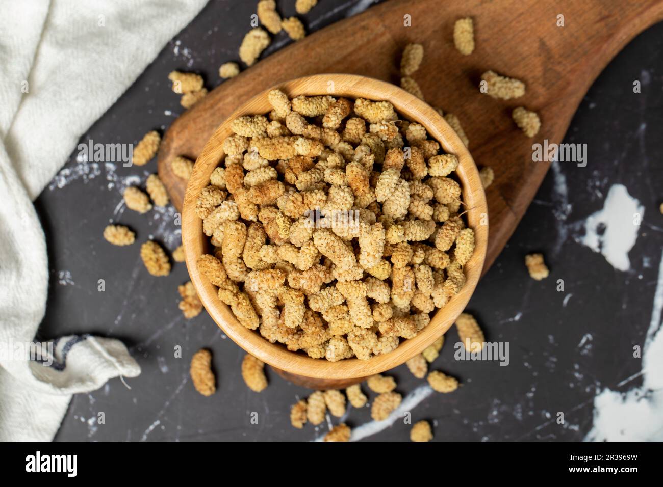 Dried mulberry. Sun-dried dried mulberry in wooden bowl. superfood ...