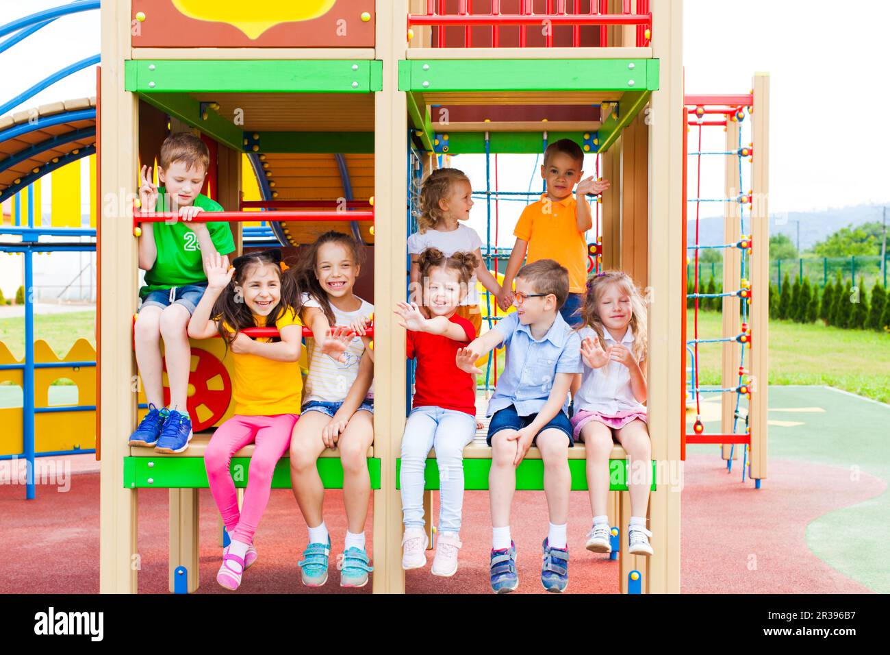 Kids having rest, sitting on ladder at playground Stock Photo - Alamy