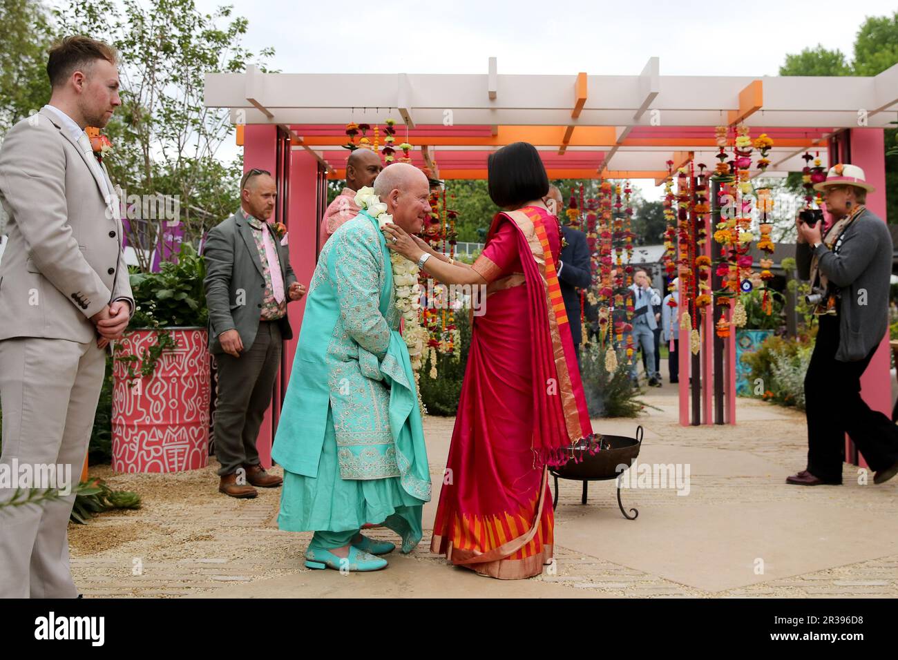 London, UK. 22 May 2023: Manoj Malde's mother put garland on Clive ...