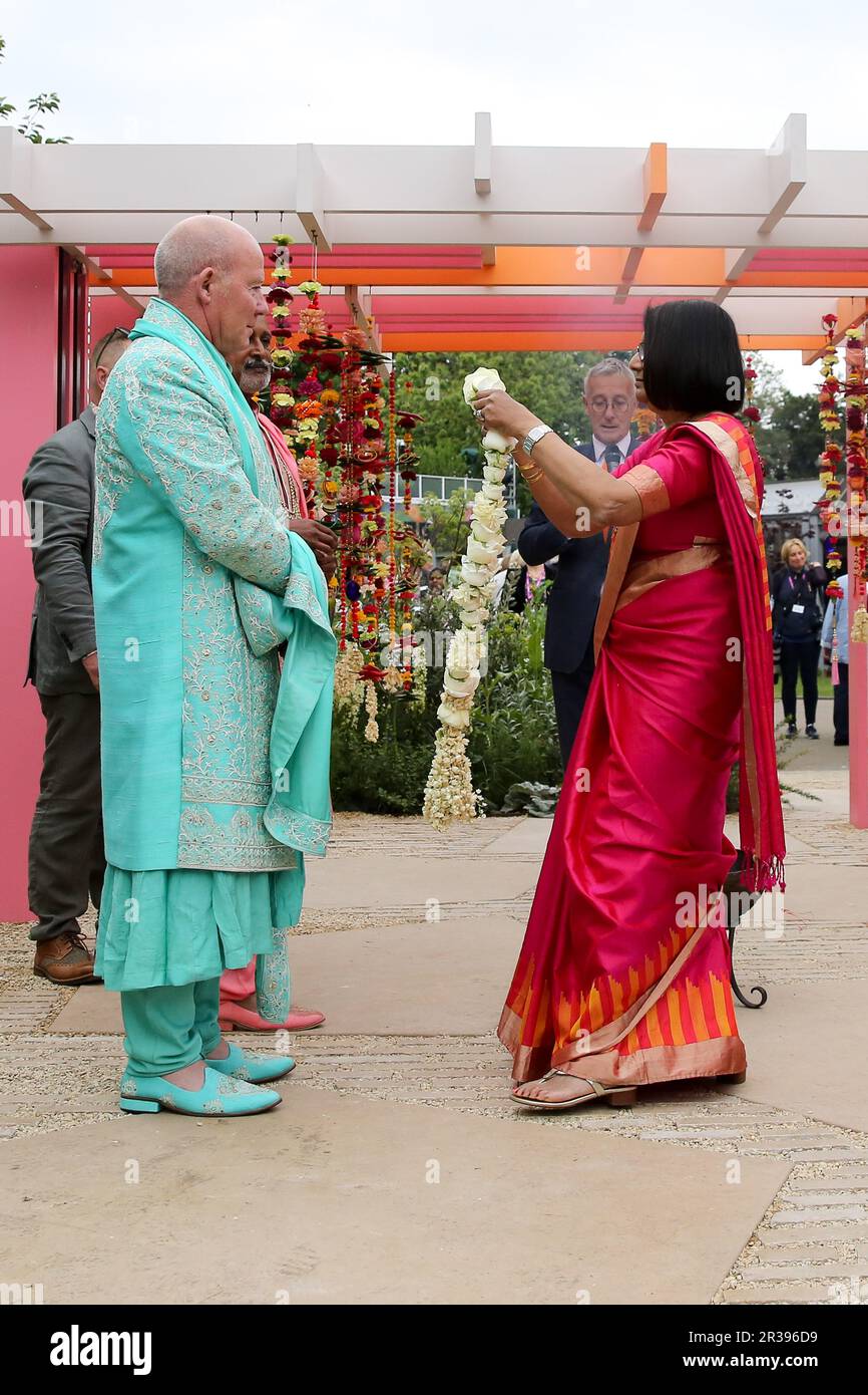 London, UK. 22 May 2023: Manoj Malde's mother put garland on Clive ...