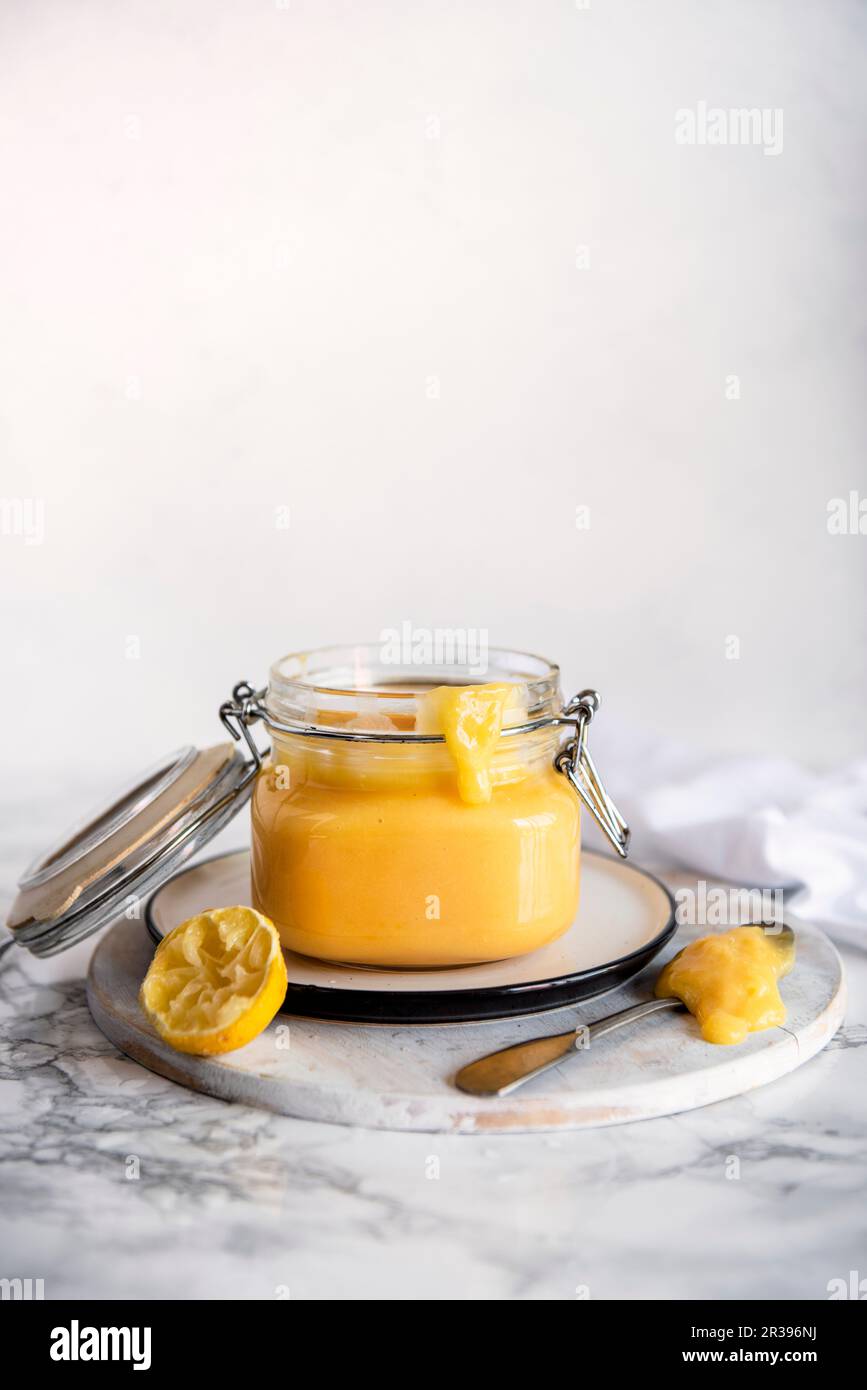 Home made lemon curd in a jar Stock Photo - Alamy