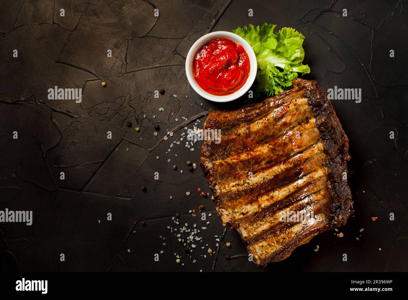 Grilled sliced barbecue pork ribs with sauce Stock Photo - Alamy