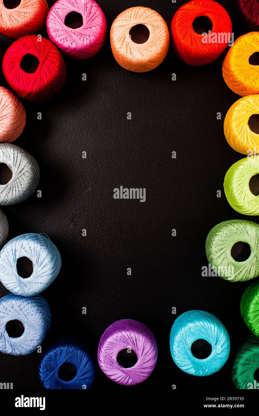 All colors yarn for knitting in the borders for design Stock Photo - Alamy