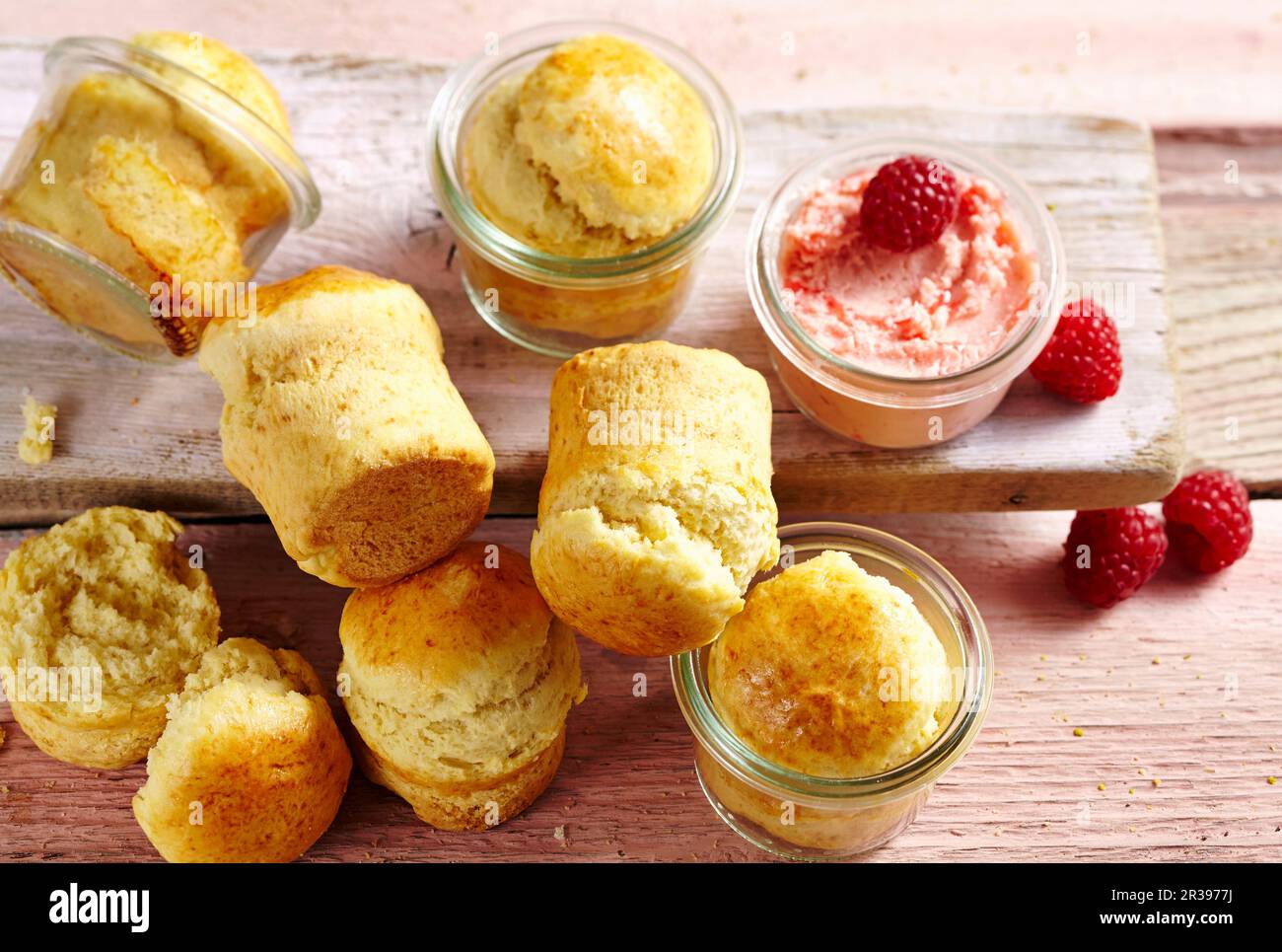 Mini scones made in jars with raspberry butter Stock Photo - Alamy
