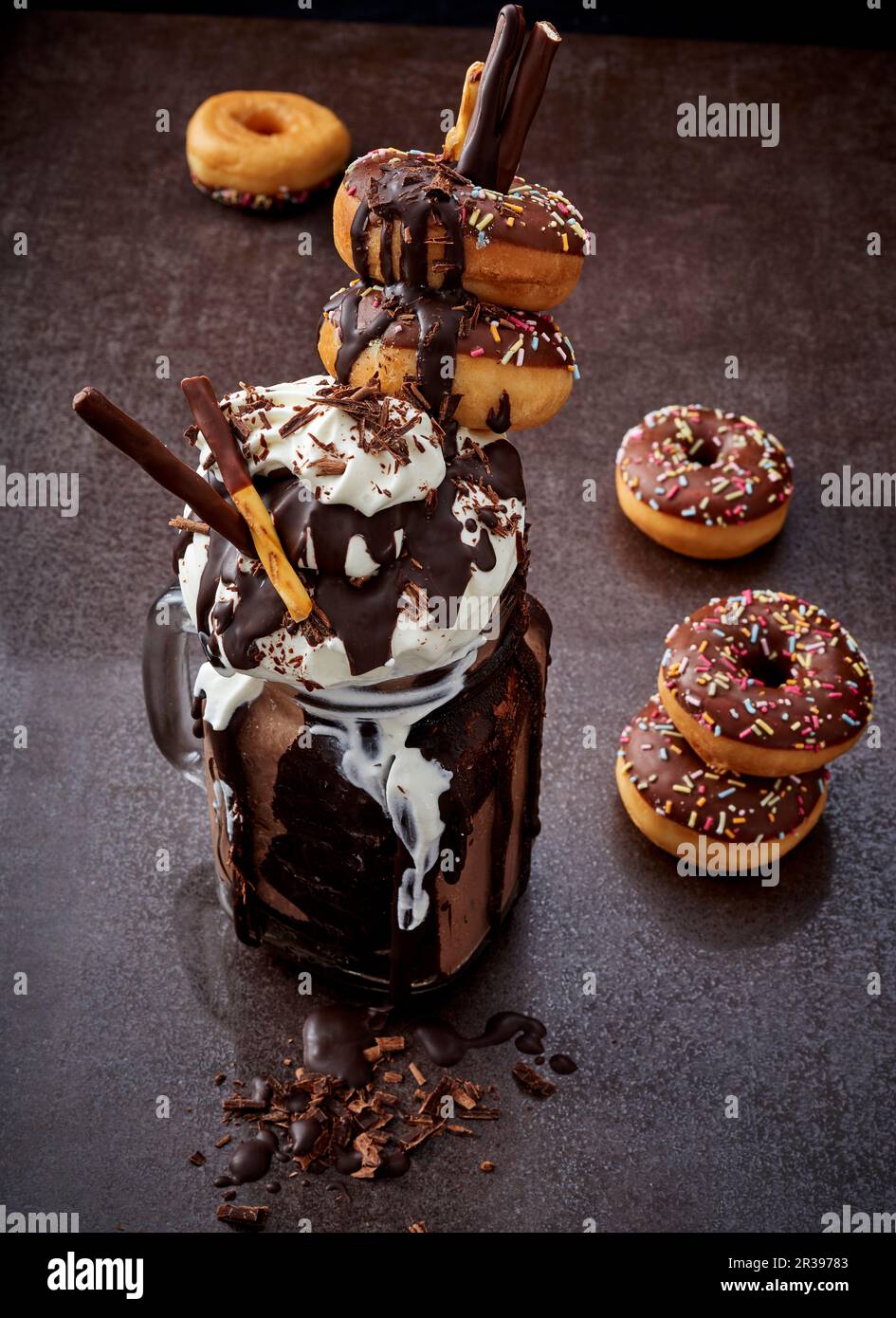 Chocolate Freak Shake topped with cream and mini doughnuts Stock Photo ...