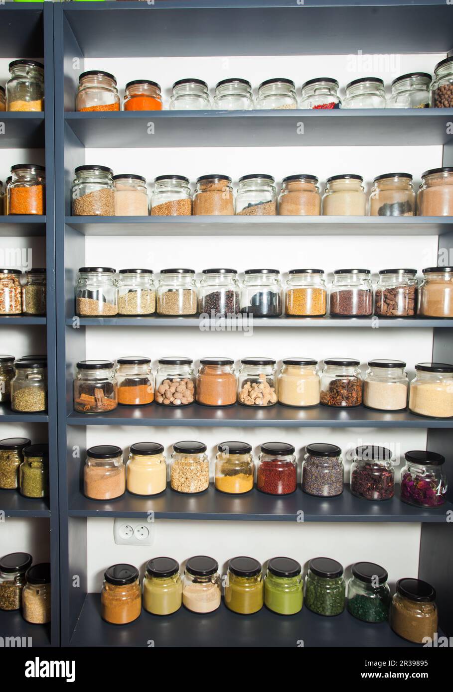 Shelf in a shop with colorful natural herbs and spices Stock Photo - Alamy