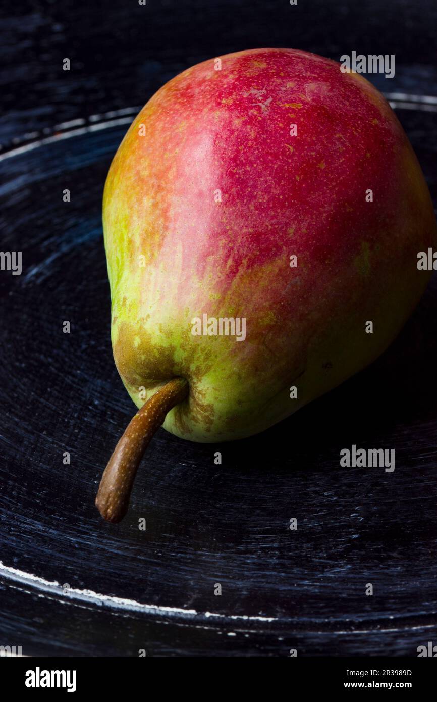 Black background photo of a pear hi-res stock photography and images ...