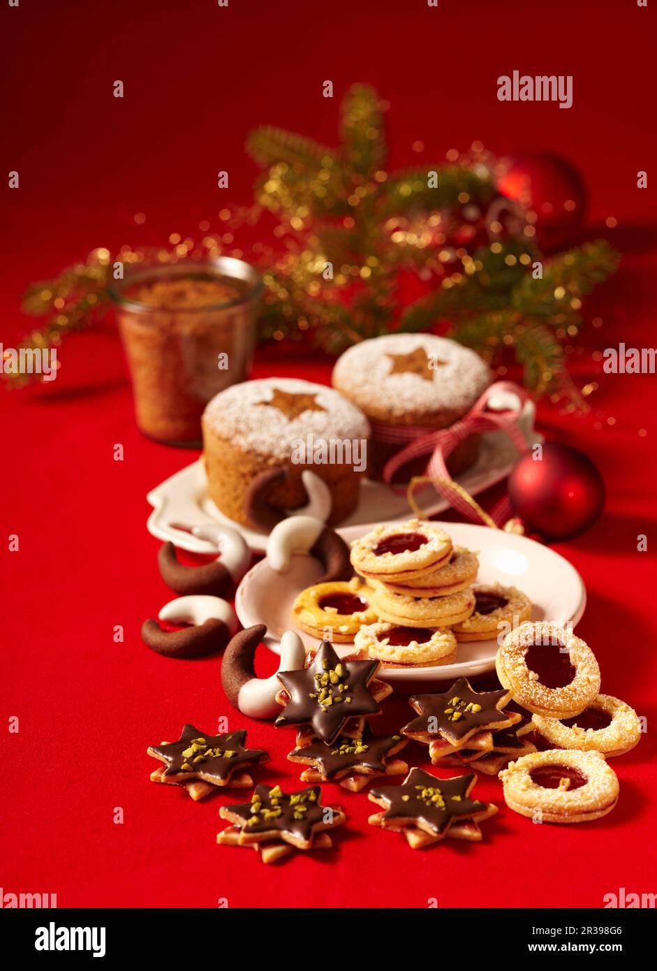 Christmas biscuits on a red surface Stock Photo - Alamy