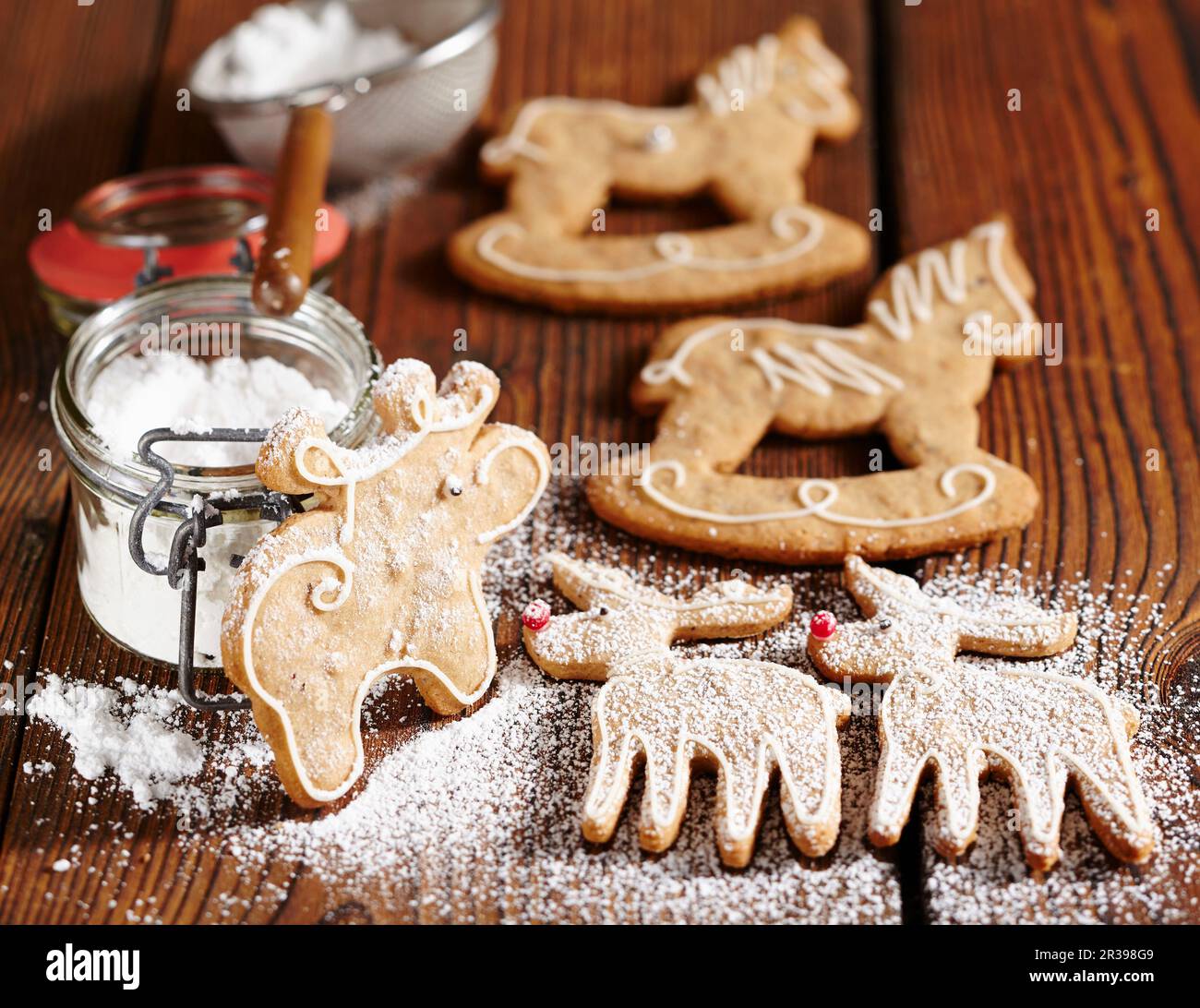 Gingerbread biscuits with icing and icing sugar Stock Photo - Alamy