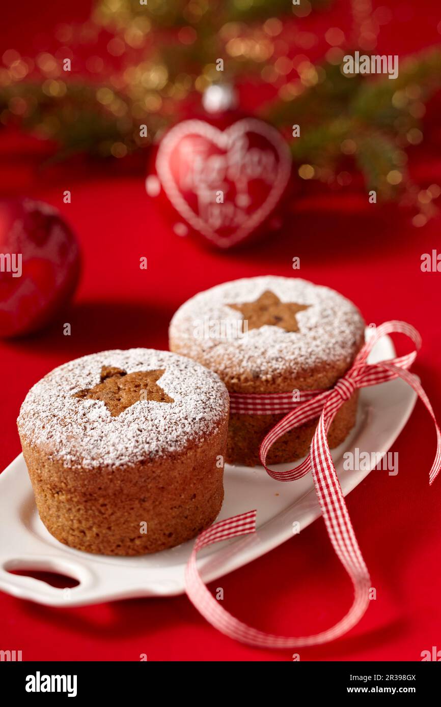 Mini chocolate cakes with icing sugar stars Stock Photo - Alamy