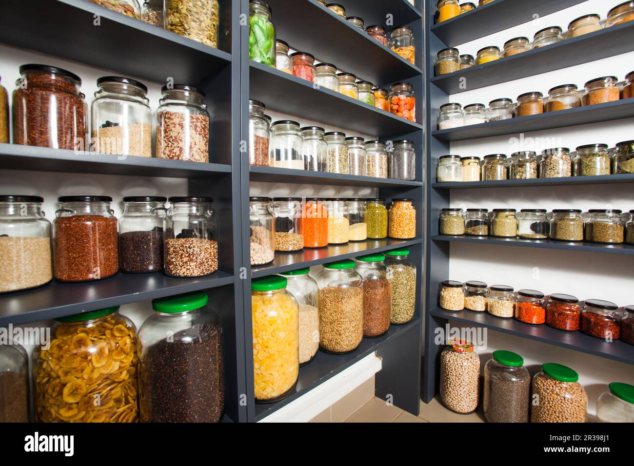 Shelf in a shop with colorful natural herbs and spices Stock Photo - Alamy