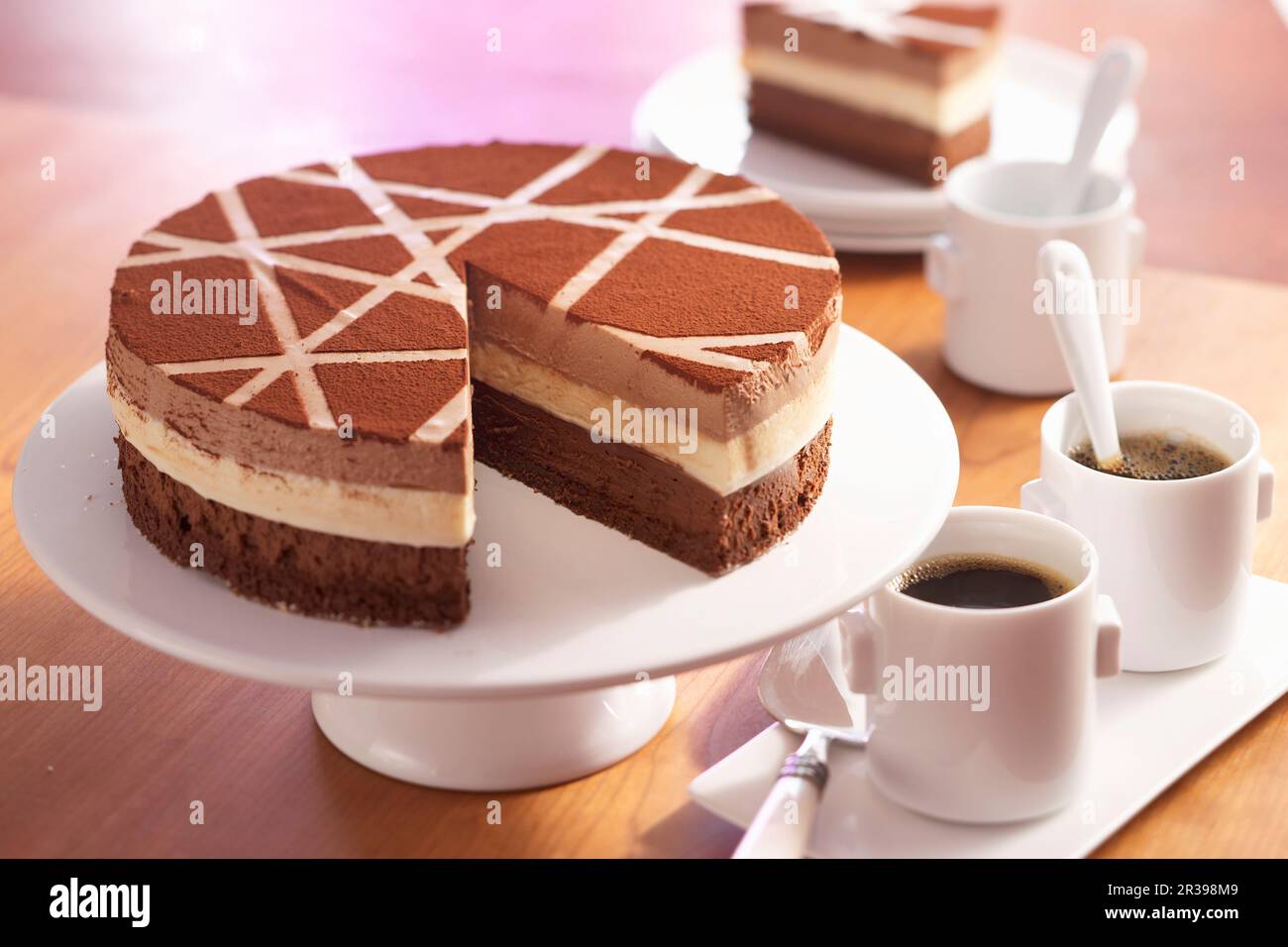 Tri-coloured chocolate mousse cake with a cocoa pattern Stock Photo - Alamy