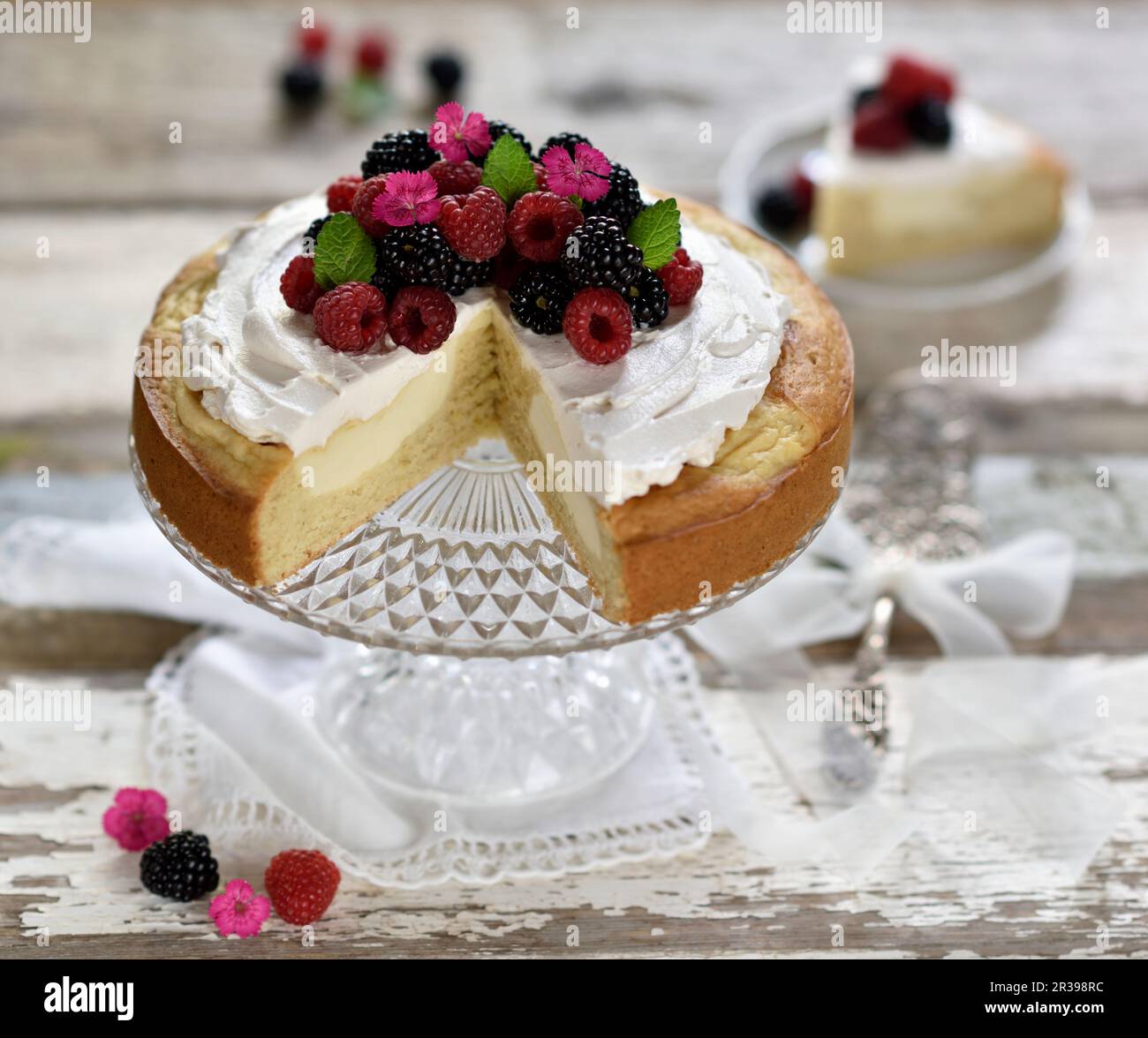 Vegan lemon sponge cheesecake with a baked quark layer decorated with ...