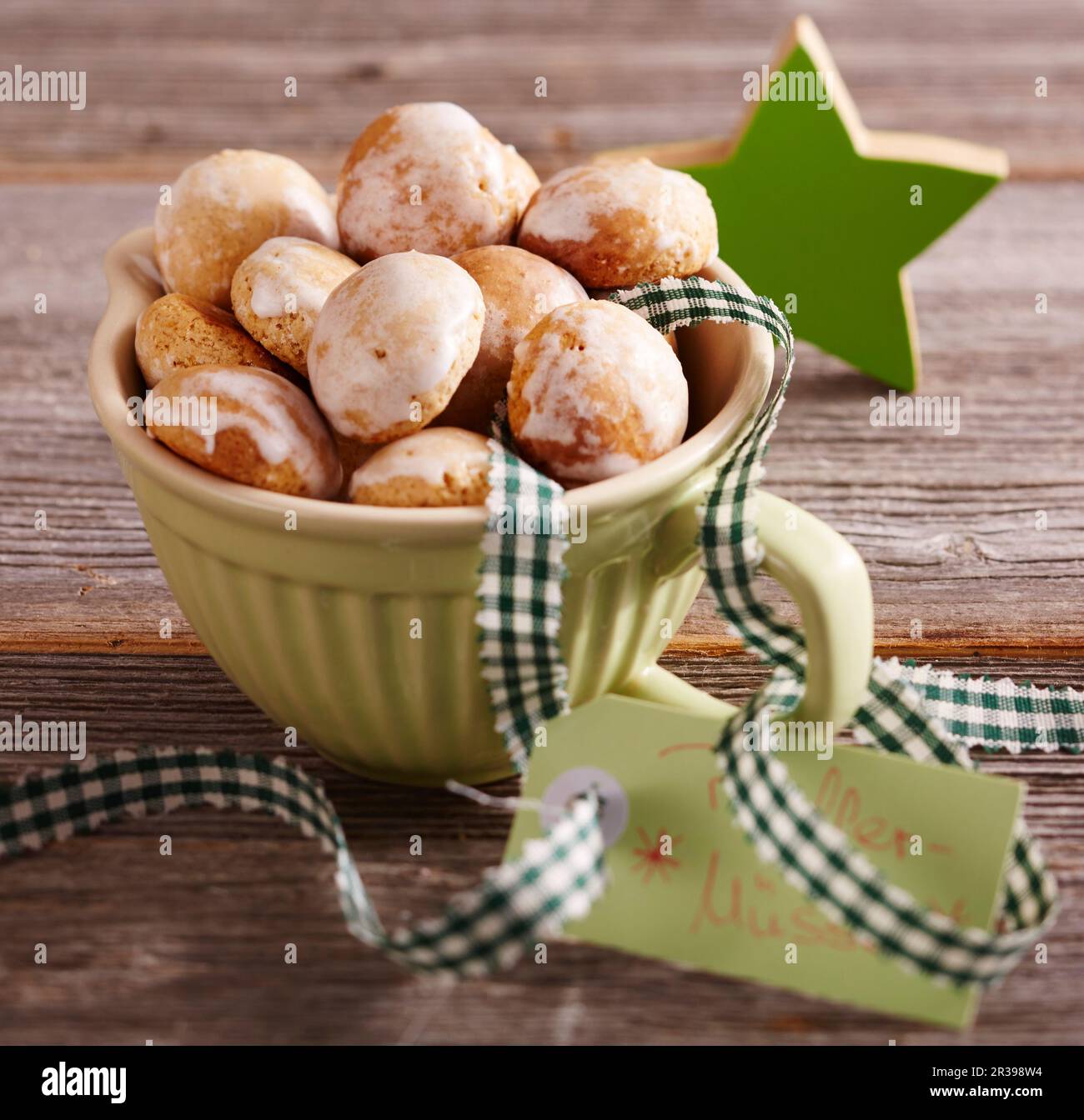 Peppernuts as a gift in a green cup Stock Photo - Alamy