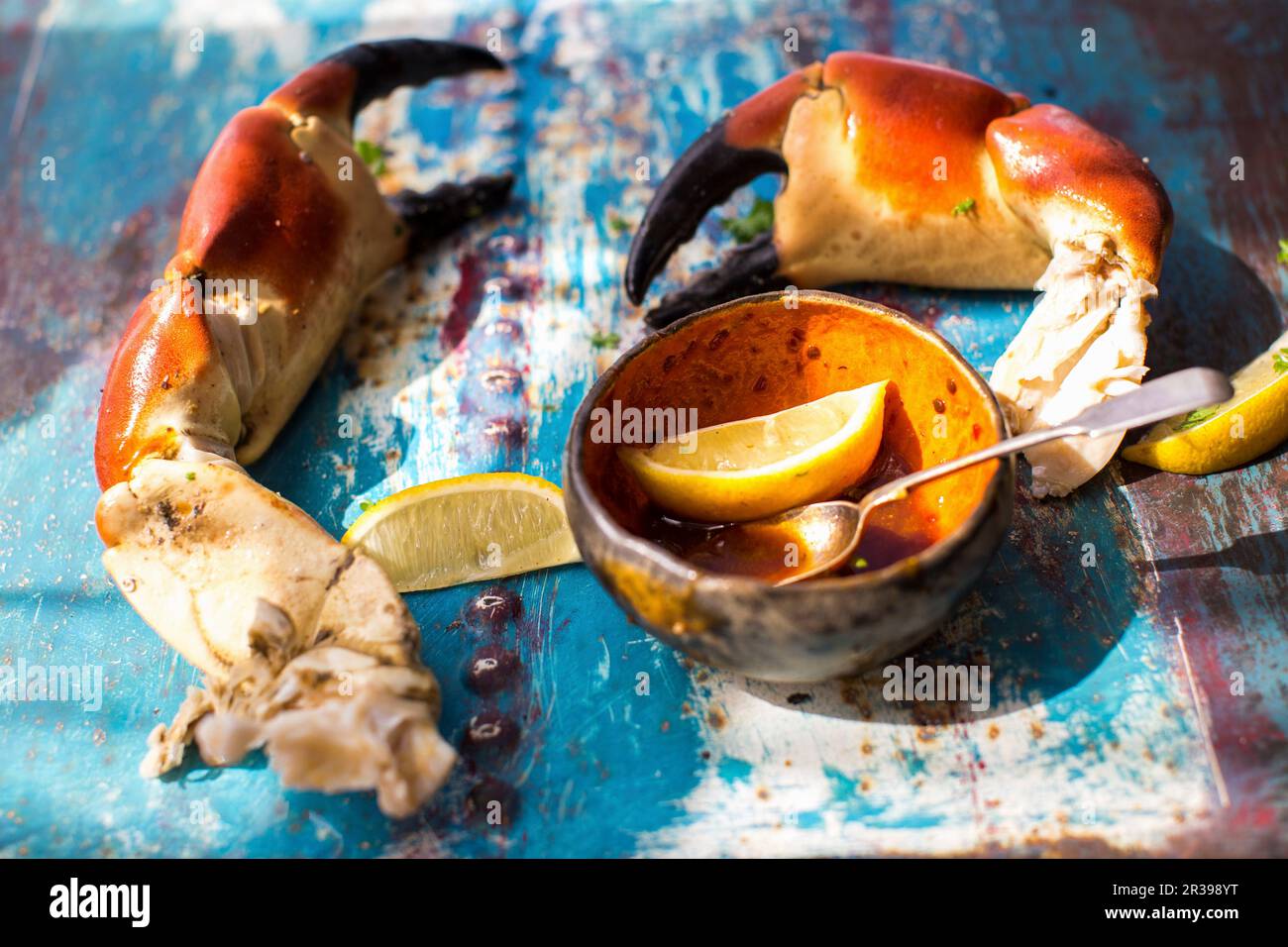 Crab claws with lemon and spicy sauce Stock Photo - Alamy