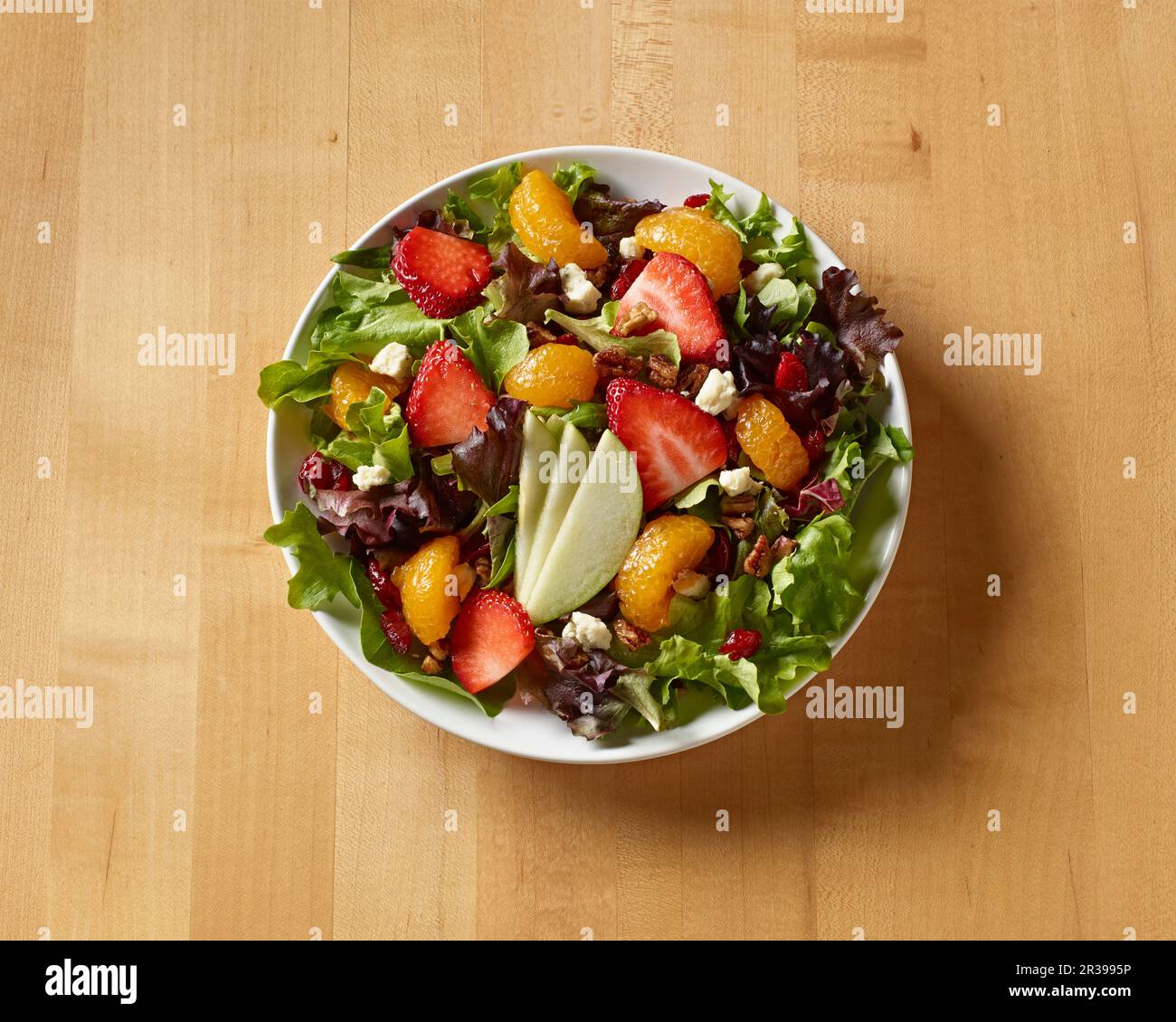 California Salad with Fresh Ingredients on Butcher Block Table shot ...