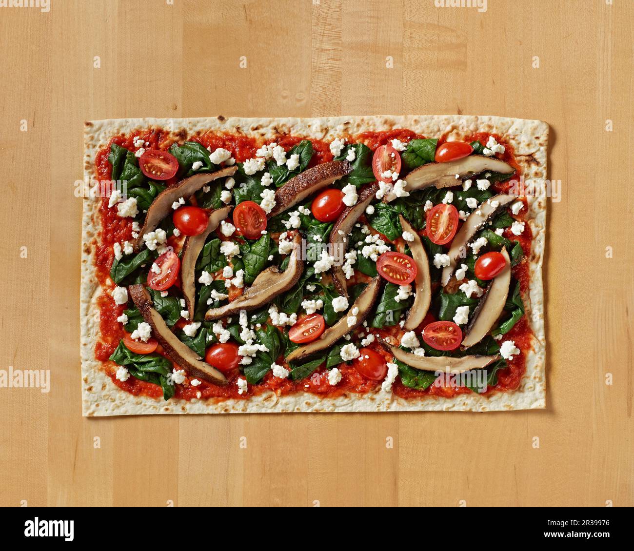Flatbread Spinach and Portabella Mushroom Pizza on Butcher Block Table ...